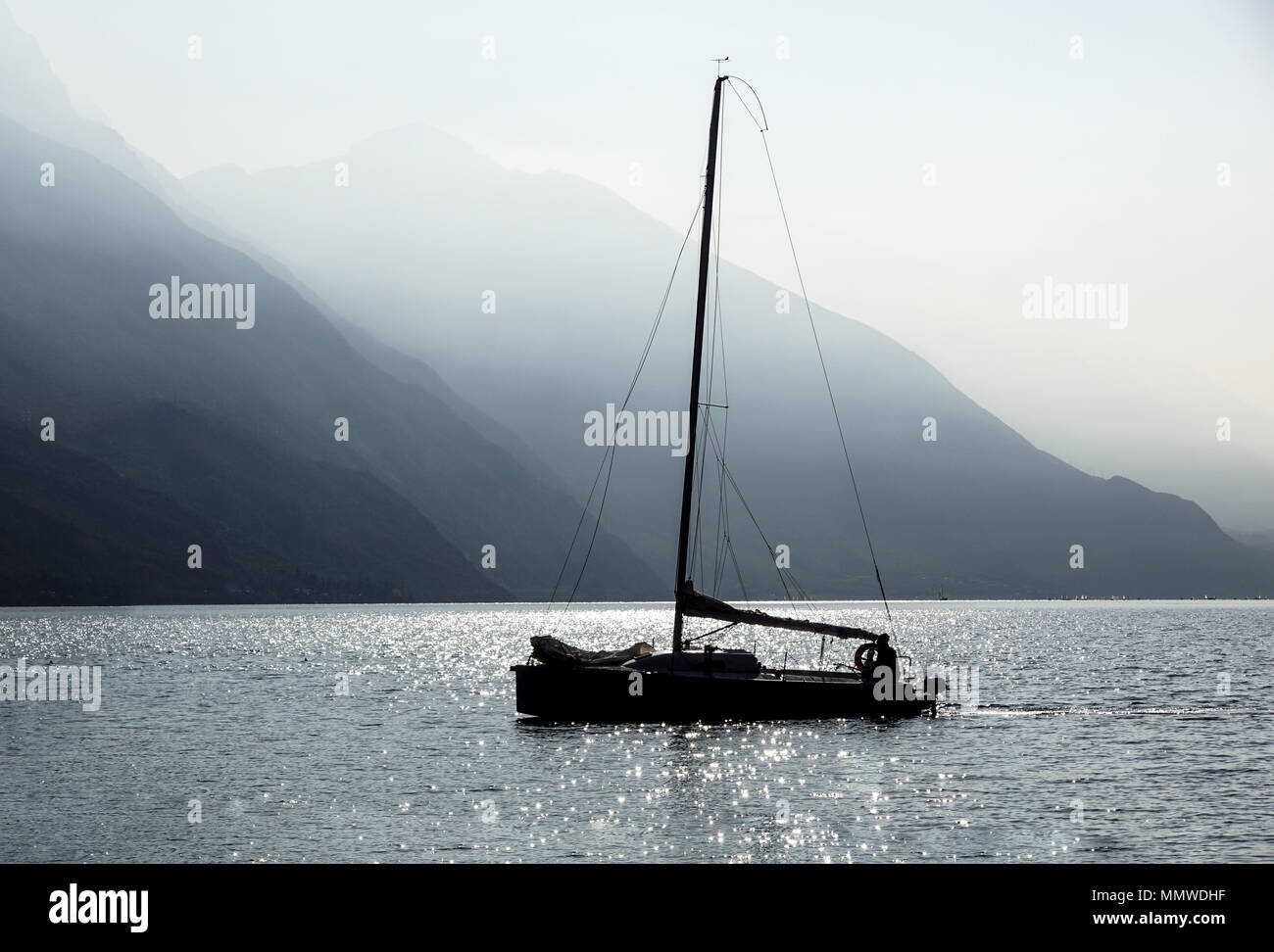 Boat wake on water surface in sunset light . lake view Stock Photo - Alamy