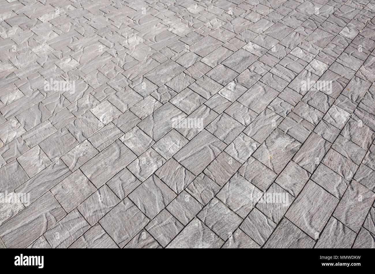 Stone pavement in perspective. Stone pavement texture. Granite ...
