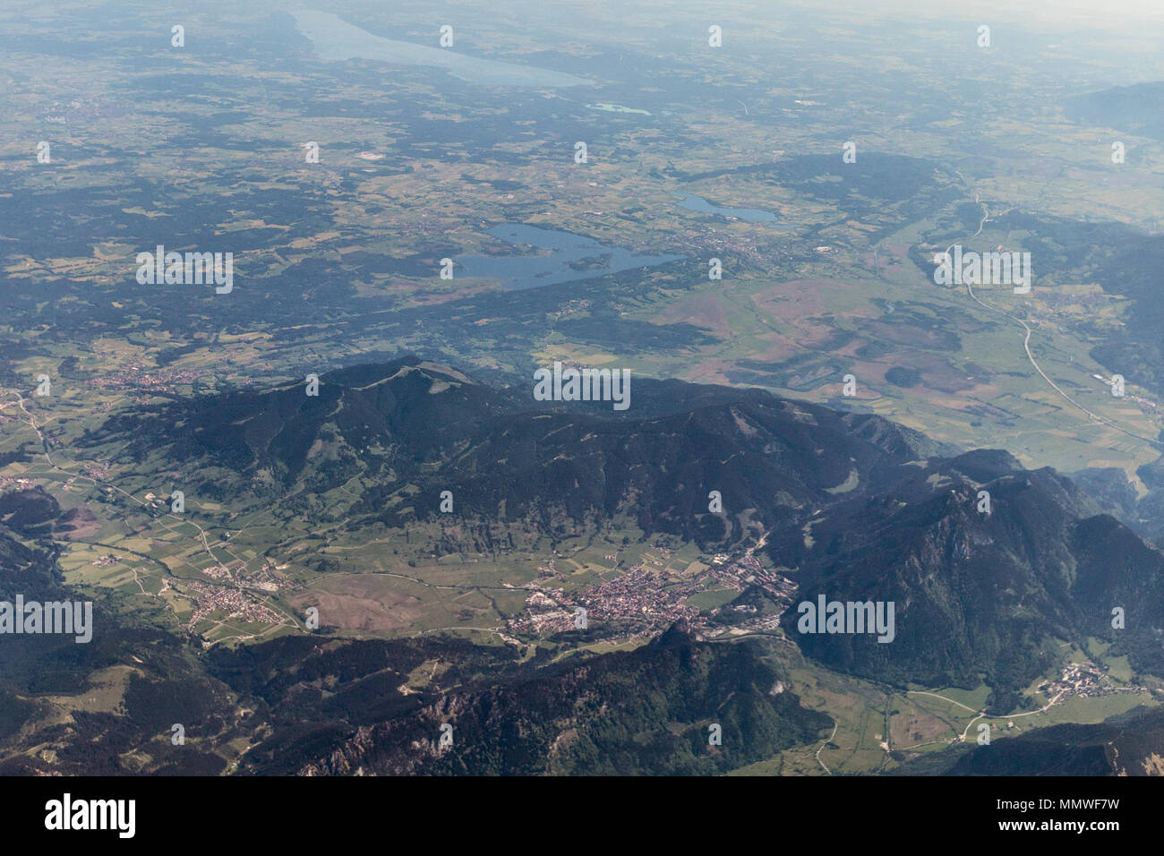 View from the airplane to the sky above the Alps mountains. Blue sky ...