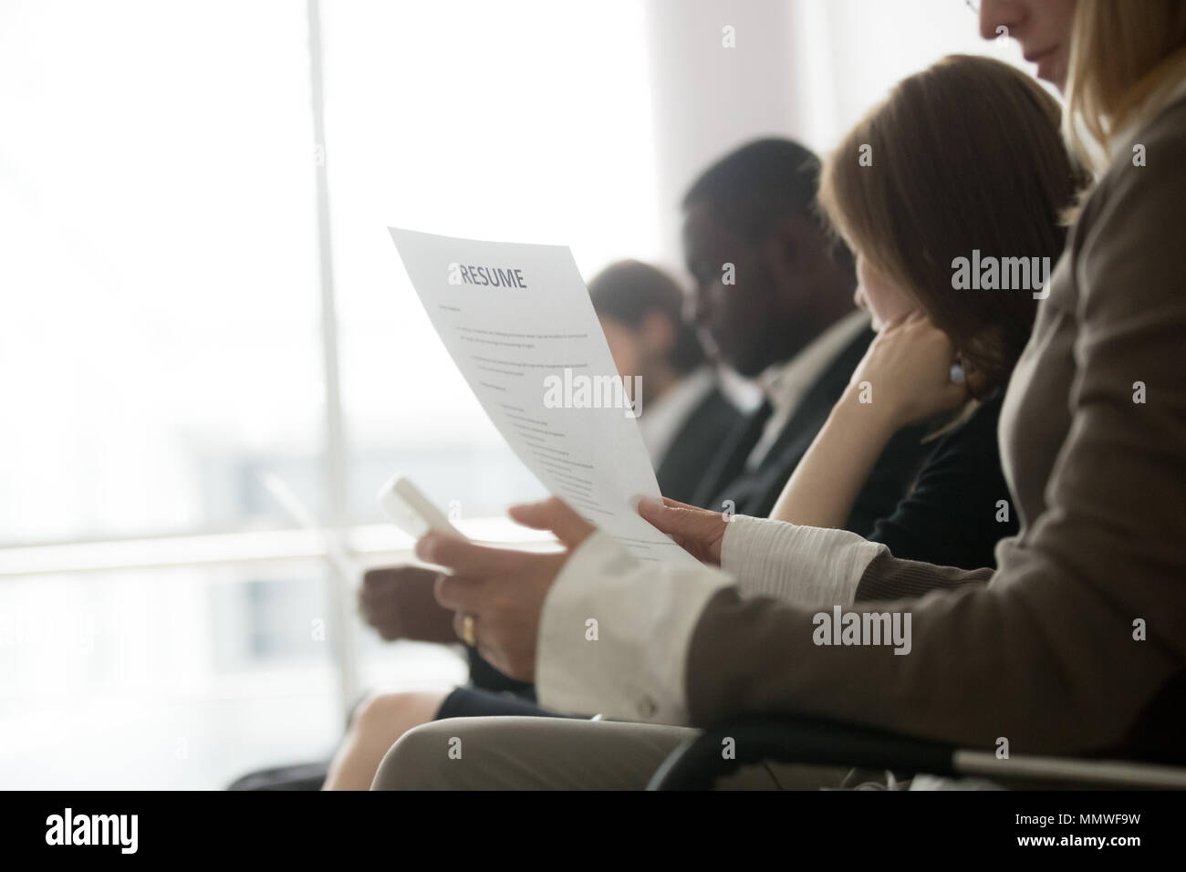 Multiracial business people waiting in queue preparing for job i Stock ... Multiracial business people waiting in queue preparing for job i Stock ...