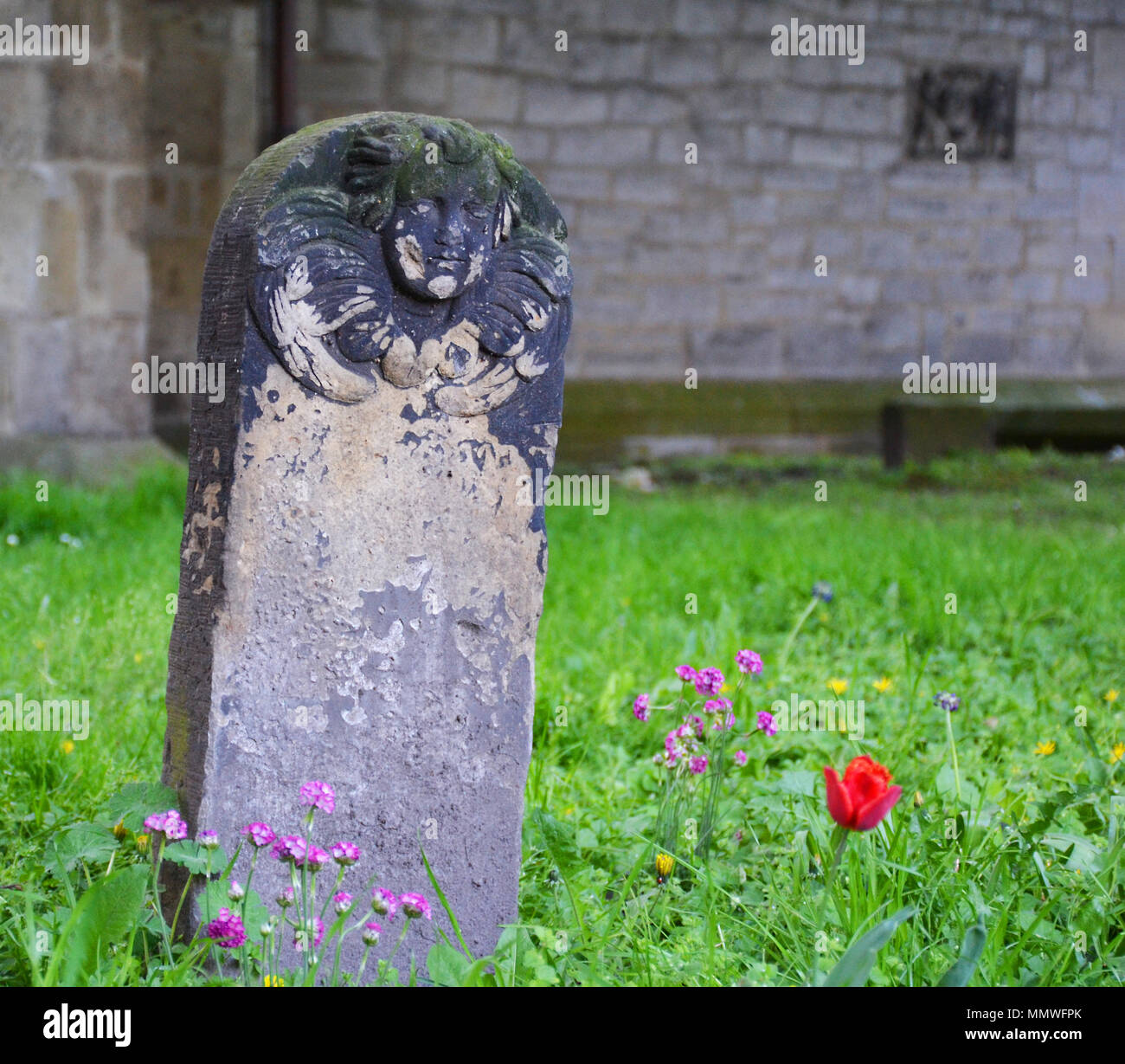 An old grave stone in the graveyard of church in Hannover, Germany ...