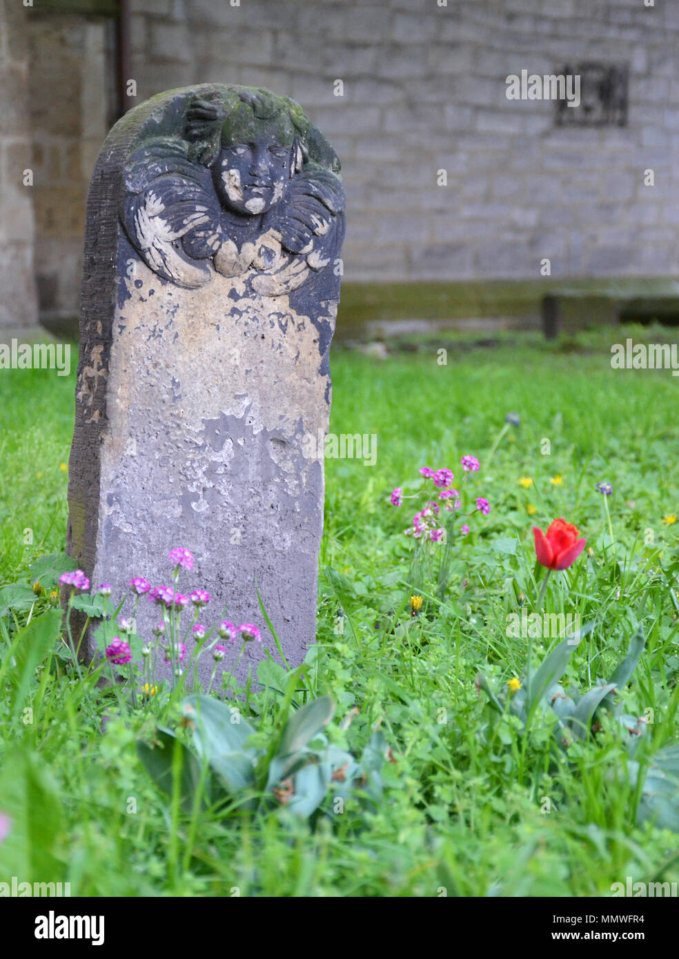 An old grave stone in the graveyard of church in Hannover, Germany ...