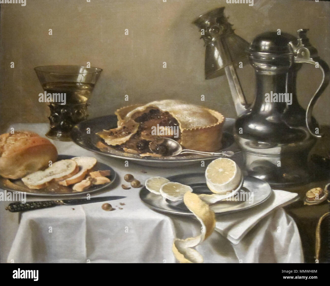 . English: A breakfast still life with bread, a sliced and peeled lemon ...