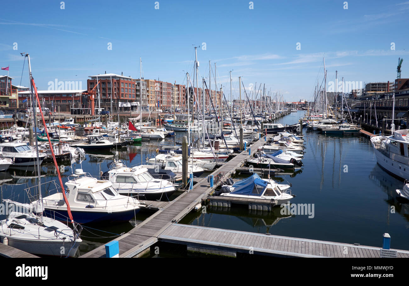 The marina with pleasure crafts and small fisher boats in Scheveningen ...