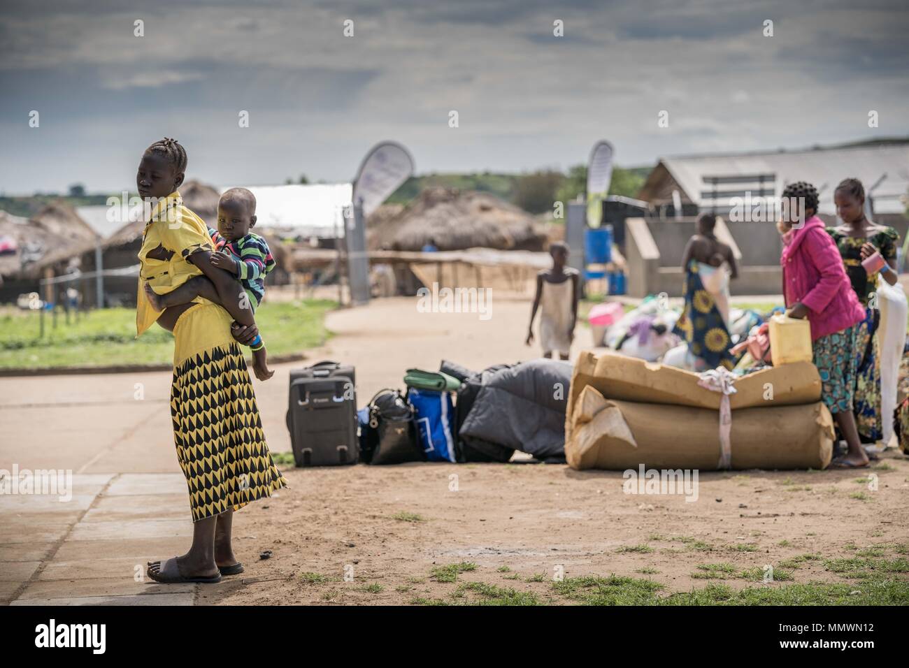 Congolese refugees seen gathering their personal belongings before ...