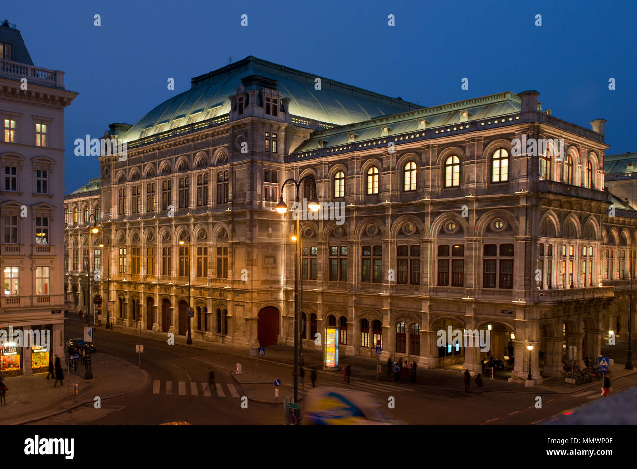 the Vienna opera house in the blue hour of early evening and festive ...