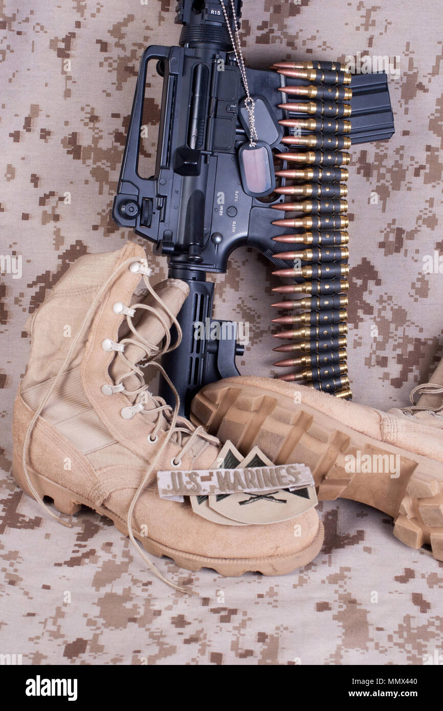 US Marines concept with firearms, boots and camouflaged uniform Stock ...