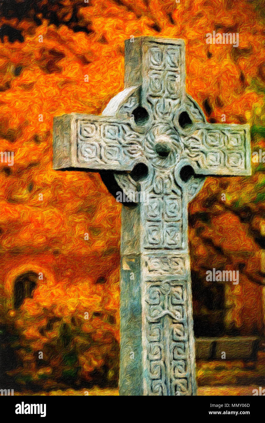 A stone Celtic cross against bright orange trees in autumn, on the ...