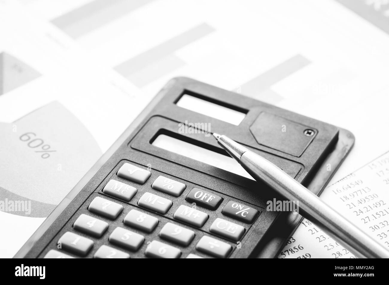 calculator and pen on book finance and account Stock Photo - Alamy