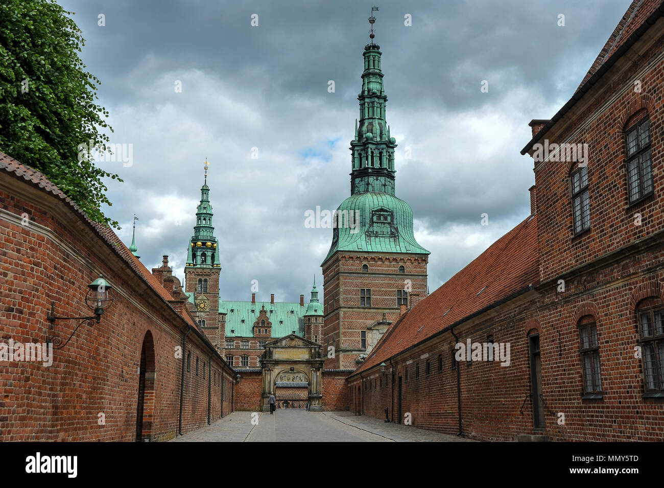 Entrance to Frederiksborg Castle, Hillerod, Denmark. Red brick building ...