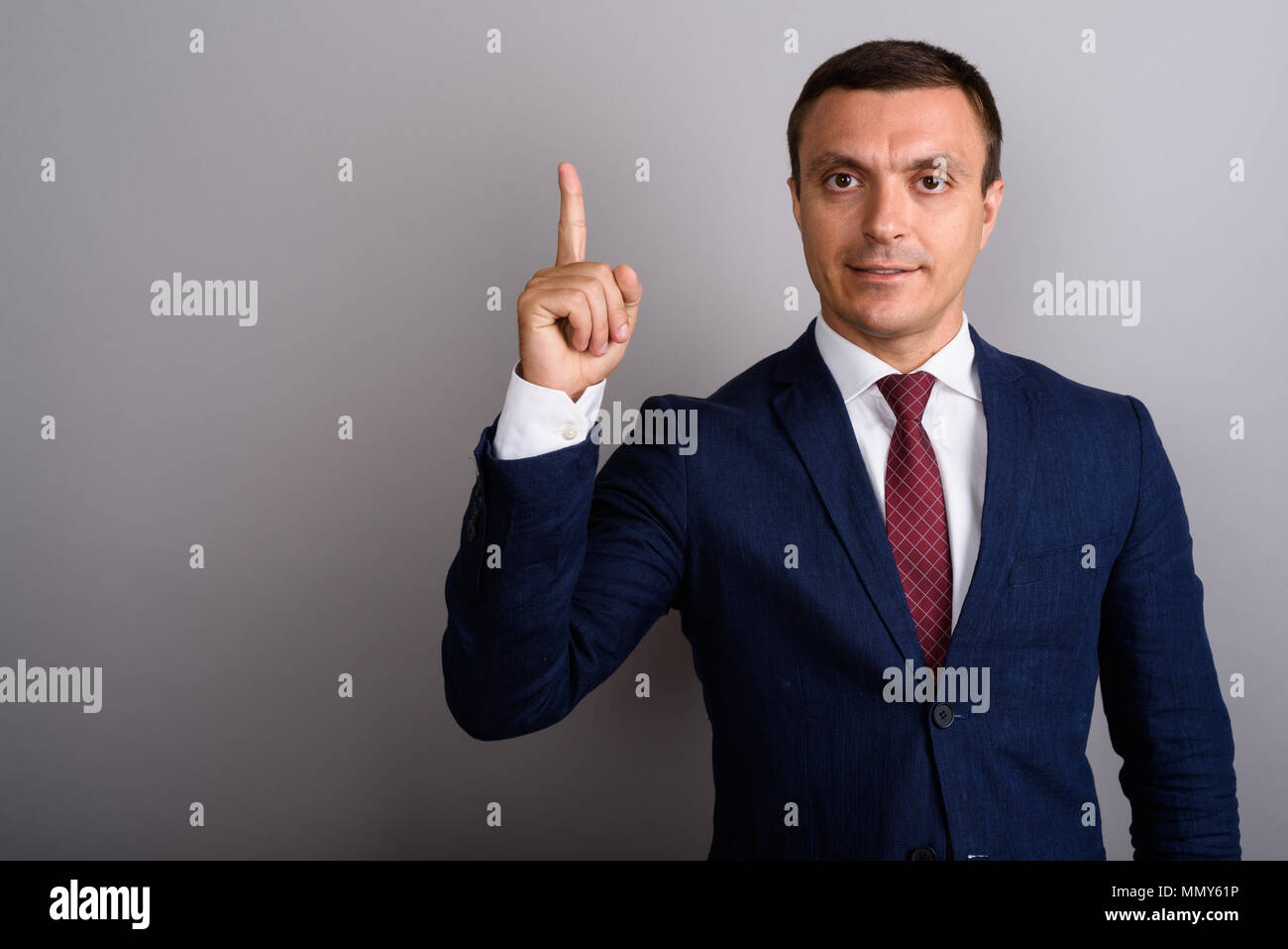Businessman suit pointing up hi-res stock photography and images - Alamy