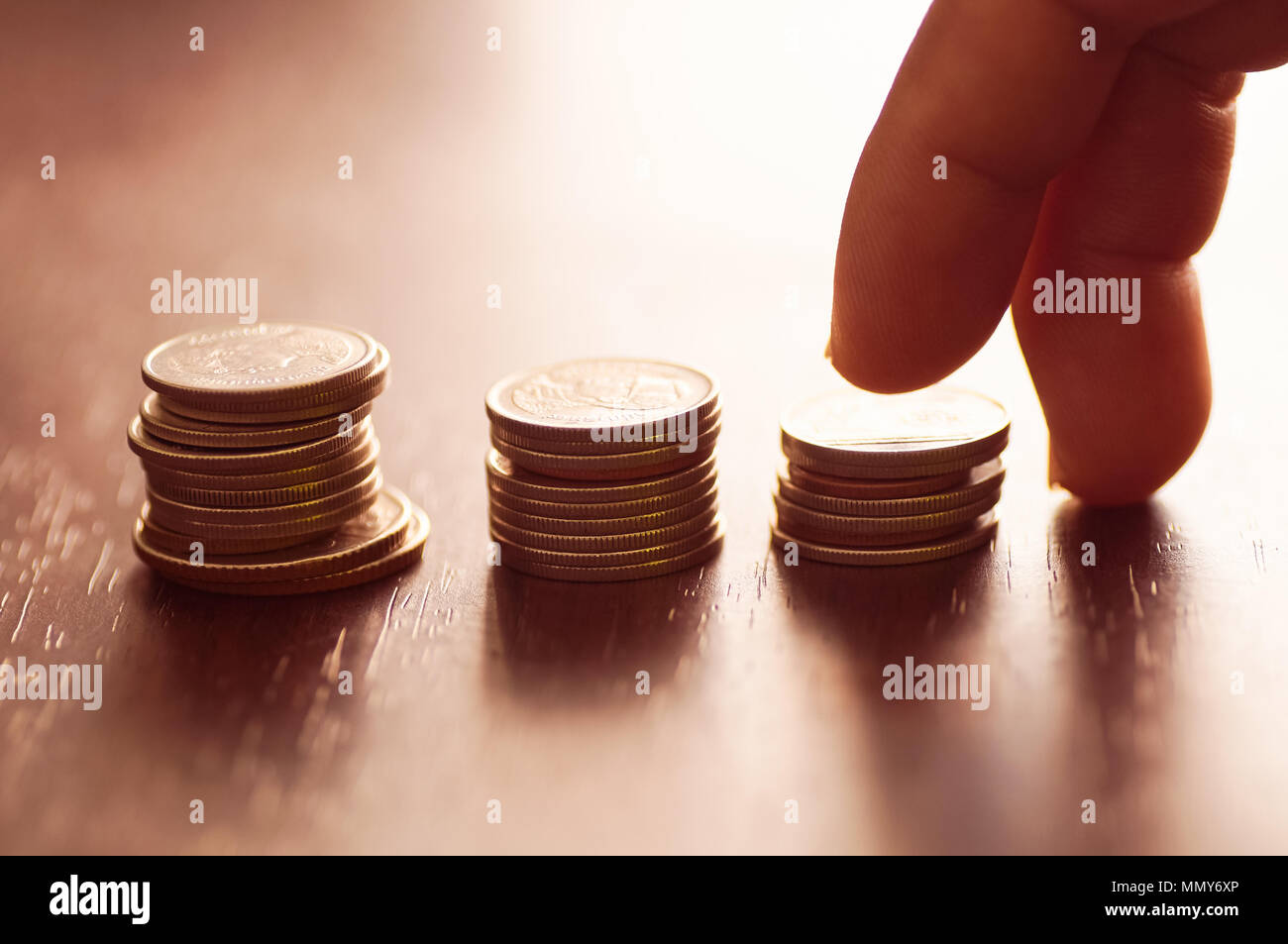 finger step on staced of coin money , concept in grow and walk step by ...
