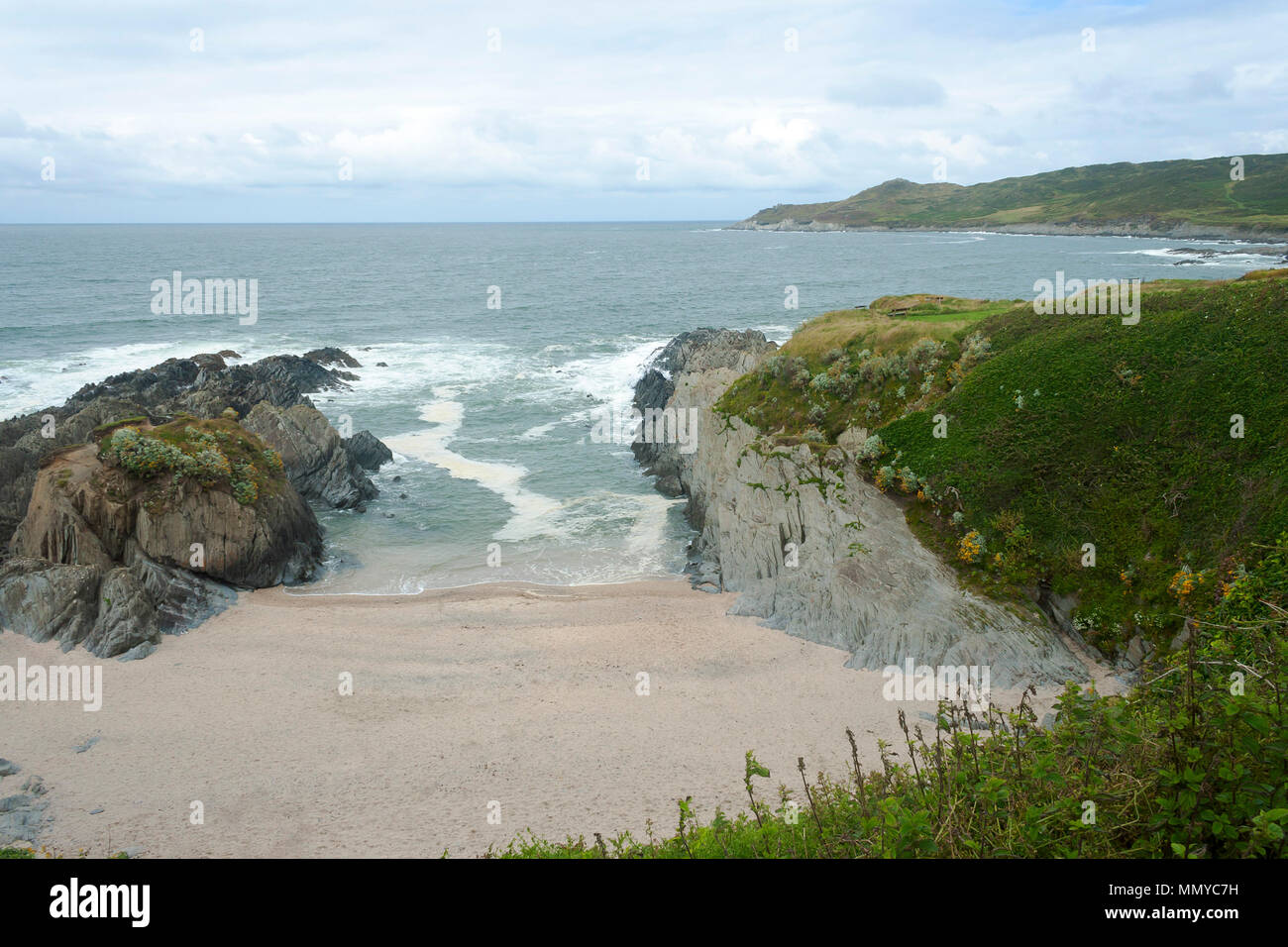 Sheltered beach in Woolacombe on a cloudy summer day Stock Photo - Alamy