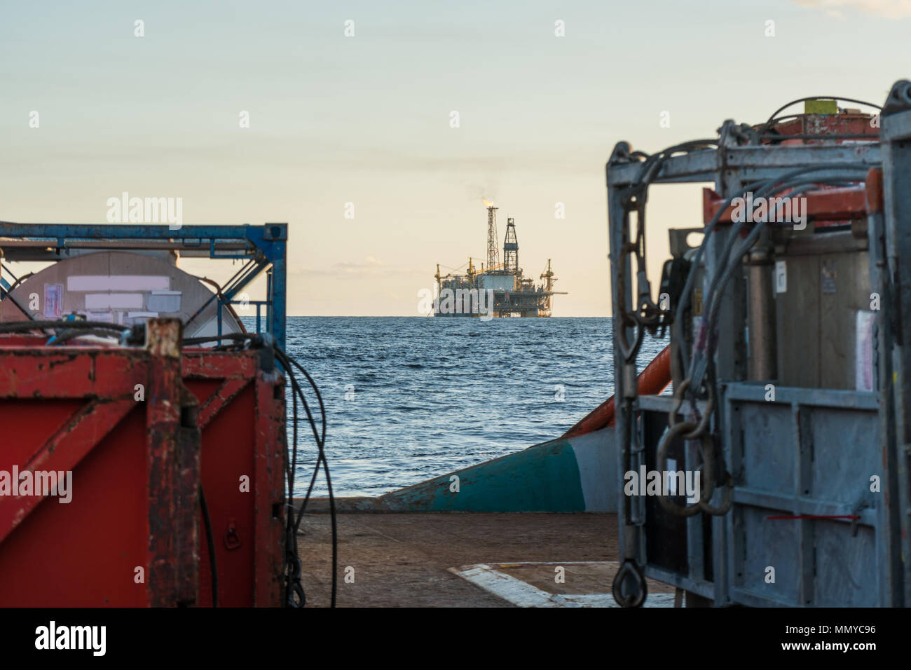 offshore supply boat with containers and tanks onboard delivers cargo ...