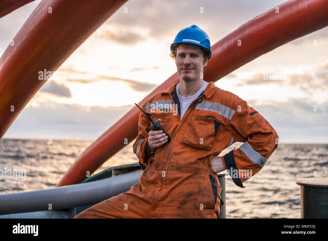 Deck Officer on deck of offshore vessel or ship , wearing PPE personal ...