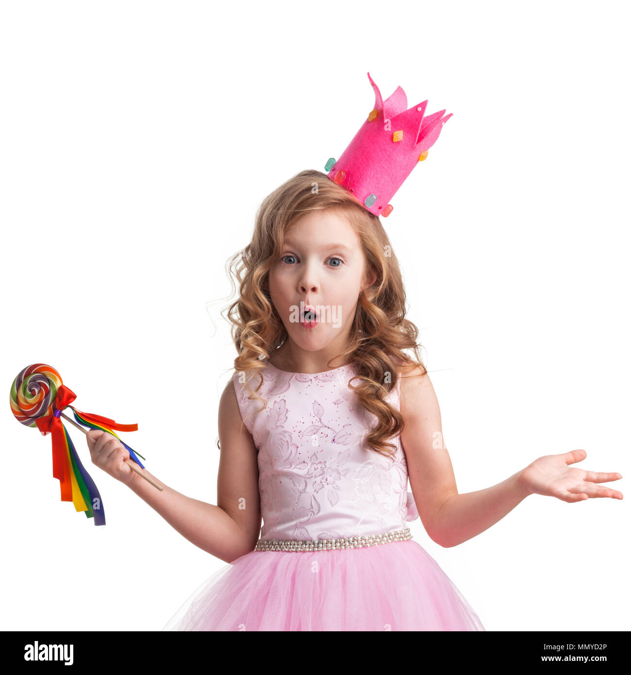 Surprised little candy princess girl in crown holding big lollipop and ...