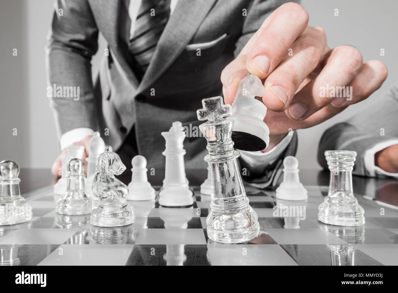 Business man playing chess, business strategy concept Stock Photo - Alamy