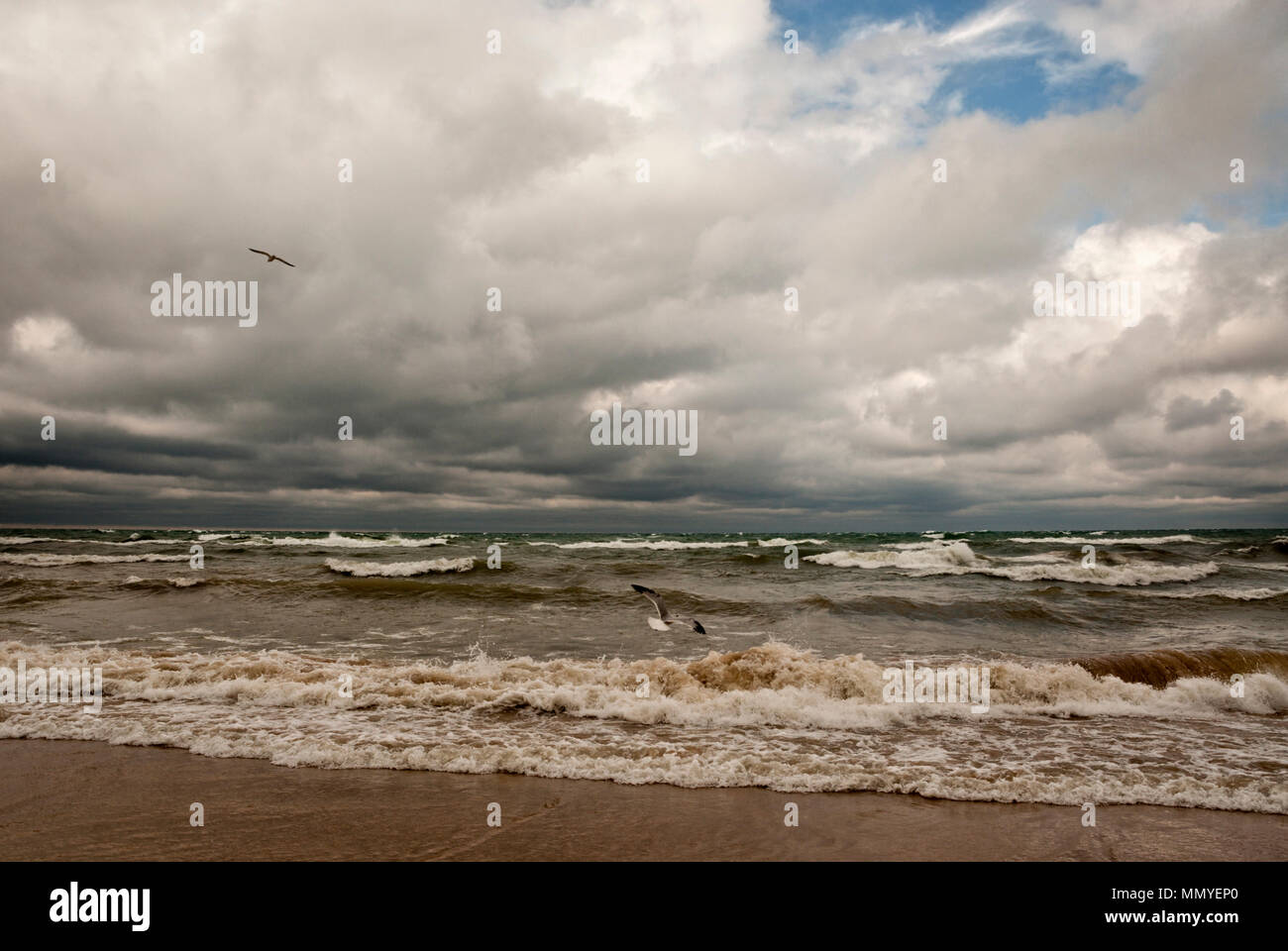 A storm brewing over Lake Michigan with dark storm clouds and strong ...