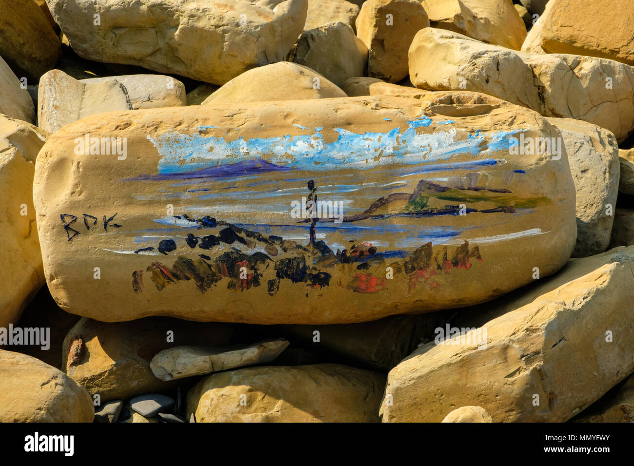 Painting on Limestone Rock Kimmeridge Bay Kimmeridge Dorset England UK ...