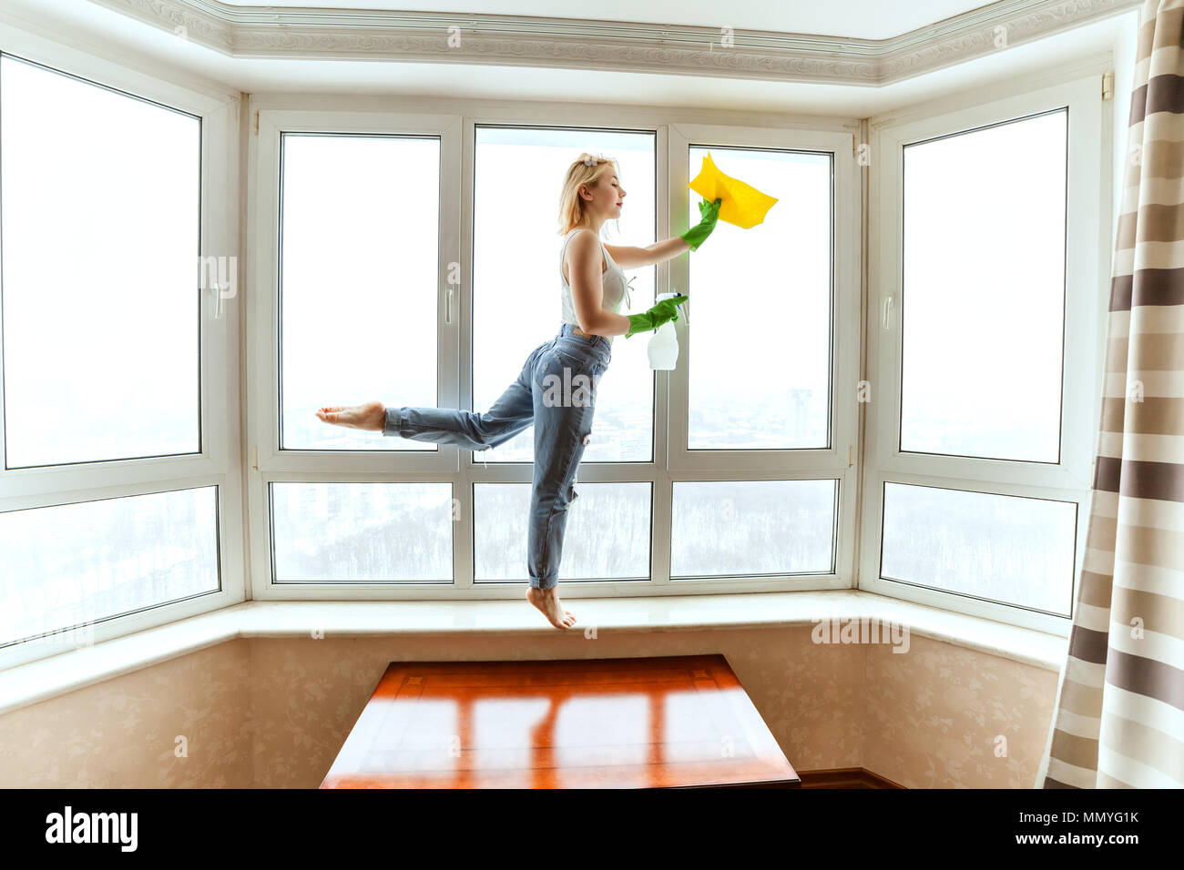 Woman dances washing windows hi-res stock photography and images - Alamy