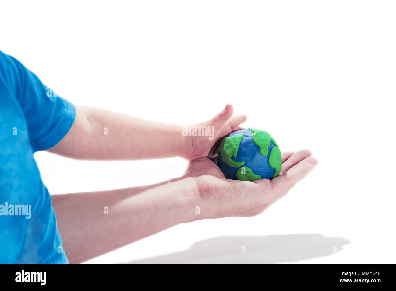 Small Earth model with human hands. Abstract composition of peace Stock ...