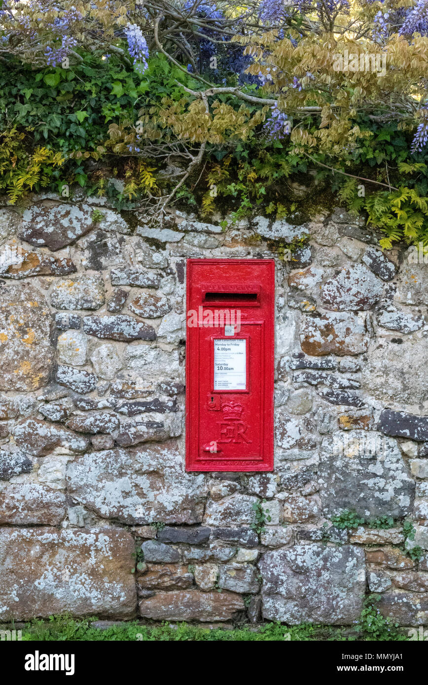 traditional English red post box in wall Stock Photo - Alamy