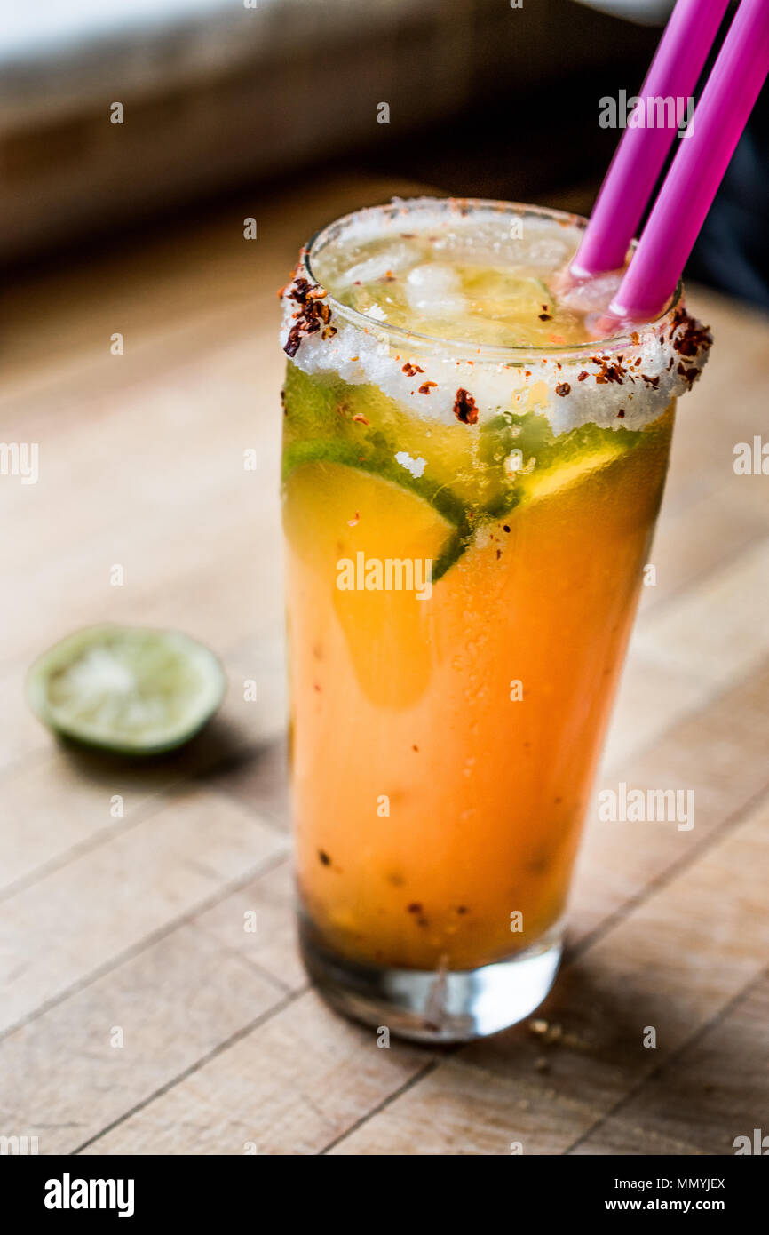 Mexican Michelada Cocktail with beer, lime, ice and spices. Beverage ...