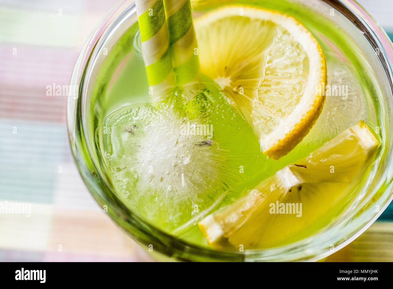 Midori Sour Cocktail with ice and lemon. Beverage Concept Stock Photo ...