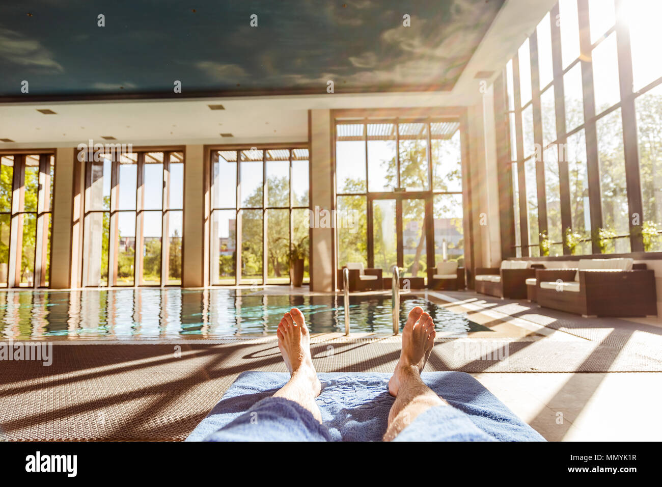 Man enjoying the summer by the pool Stock Photo - Alamy