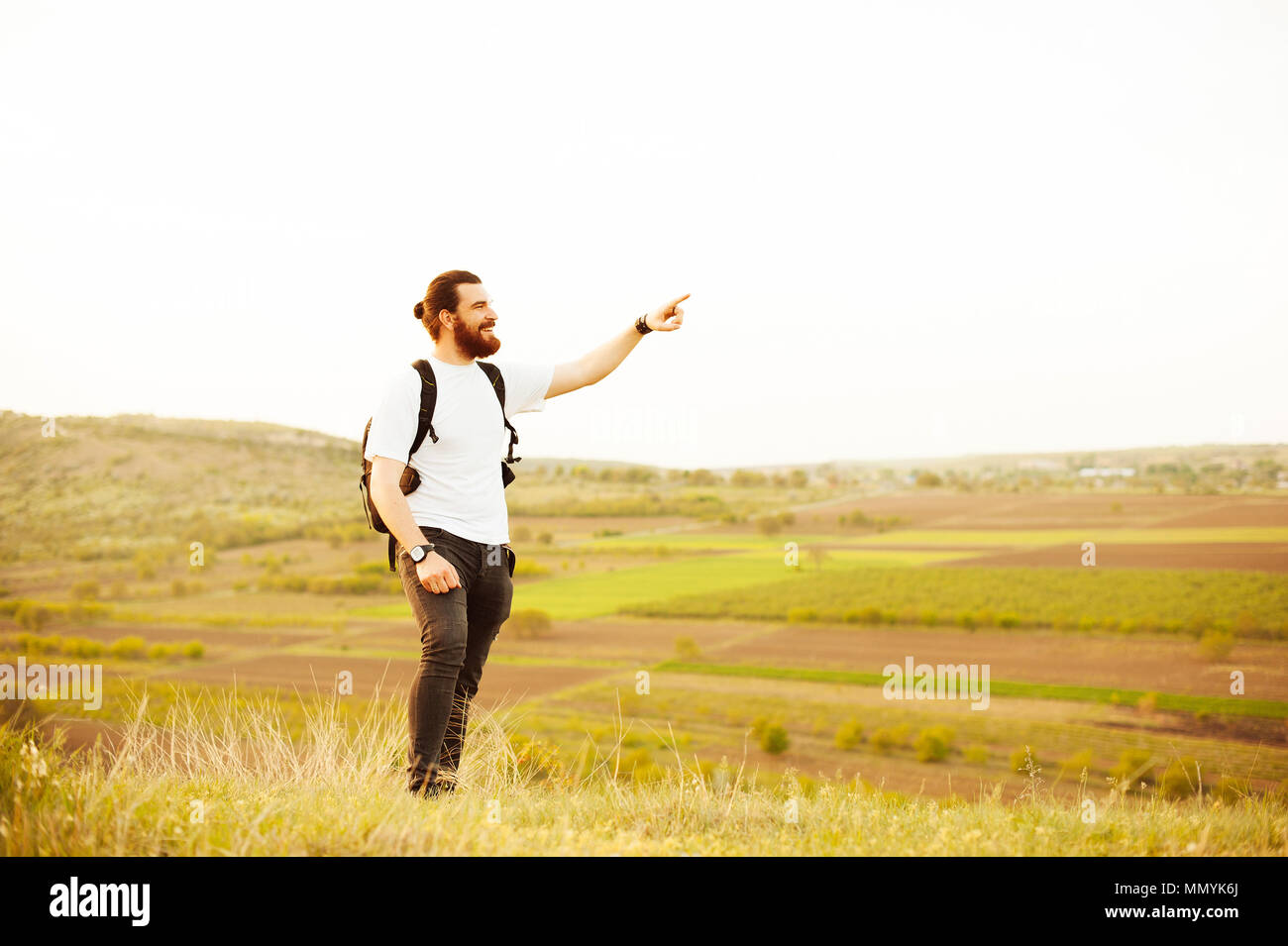 Tourist pointing at landmark Stock Photo - Alamy