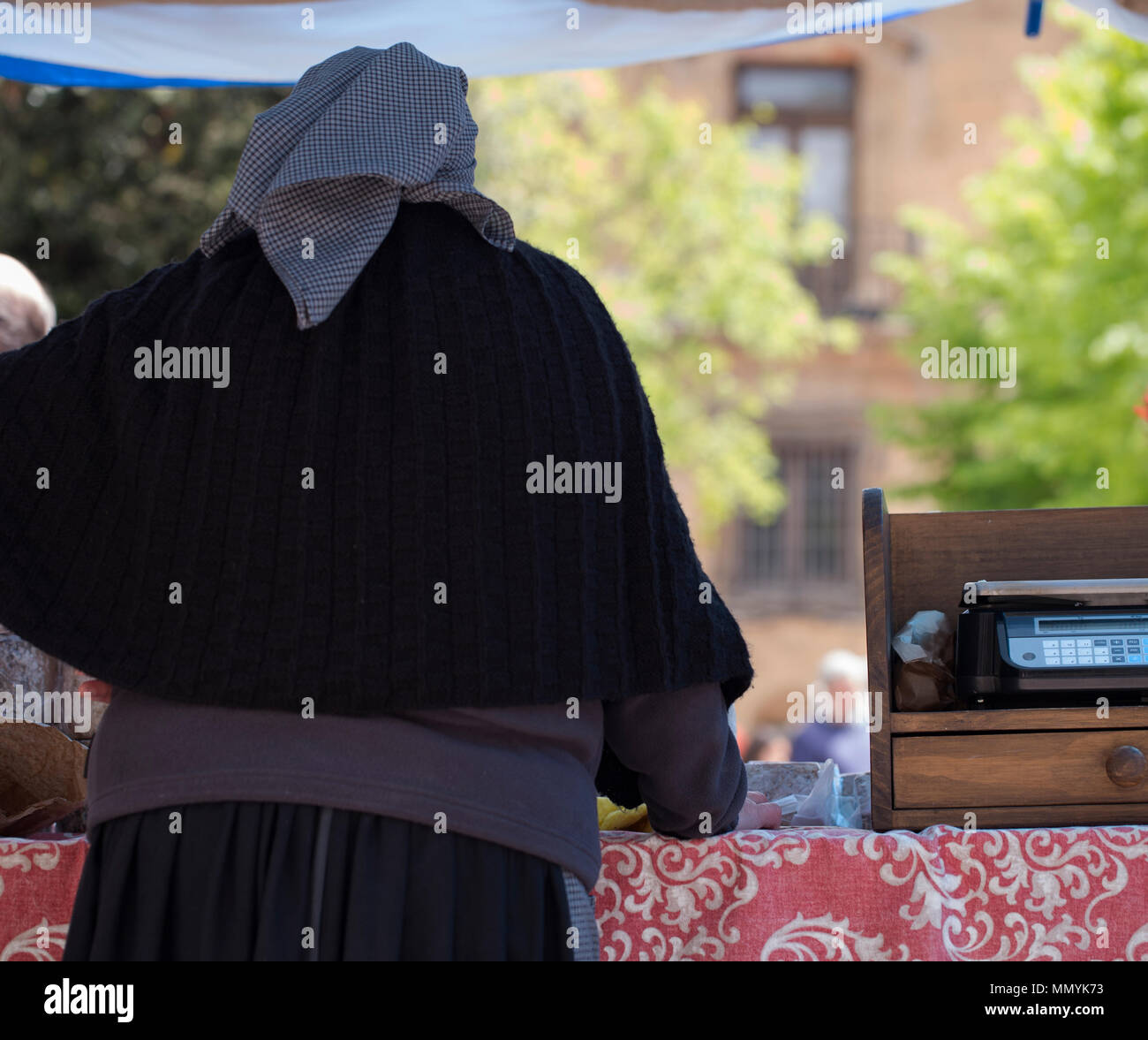 Rear view of a woman wearing traditional costume Stock Photo - Alamy