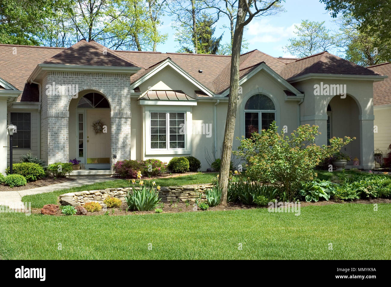 Attractive ranch home with many roof peaks and arches. Just one of many ...