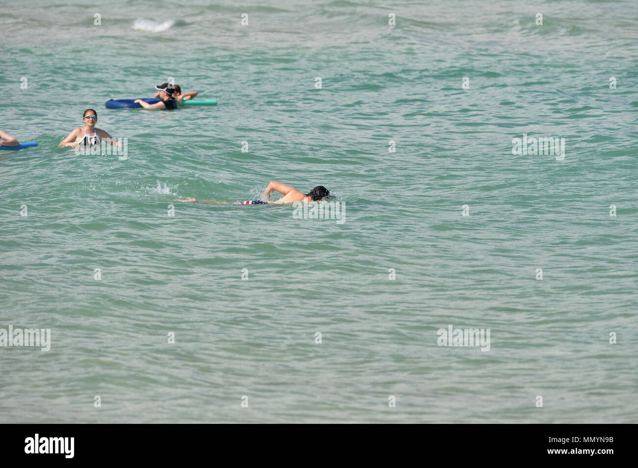 MIAMI BEACH, FL - MAY 14: Actor Jon Bass goes for a swim wearing ...
