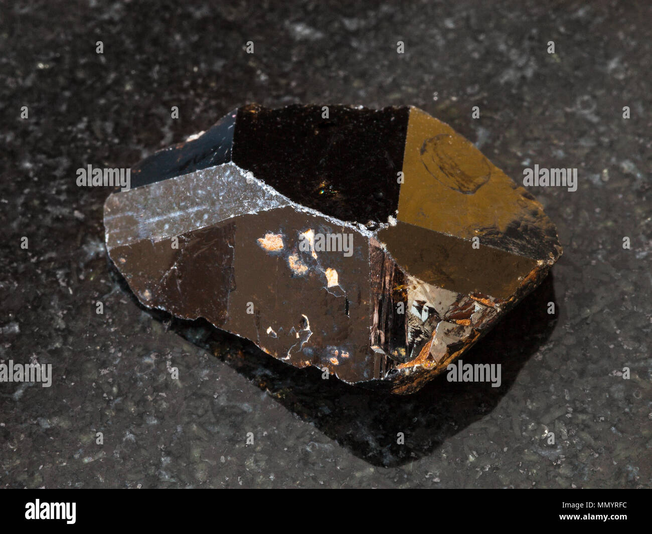 macro shooting of natural rock specimen - crystal of Cassiterite (Tin ...
