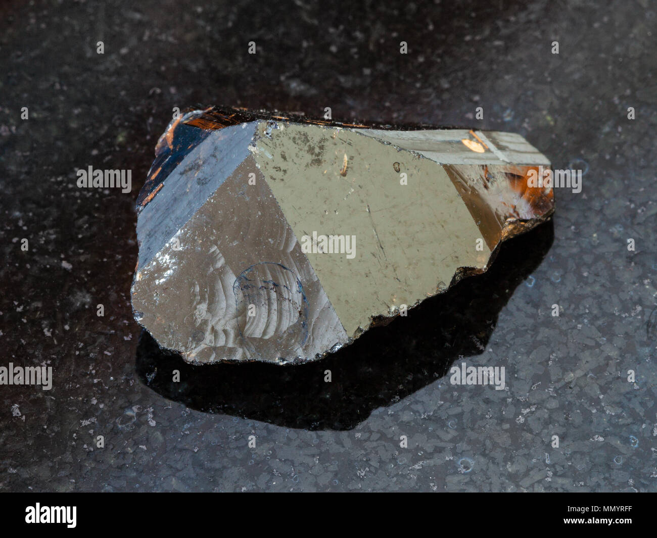macro shooting of natural rock specimen - raw crystal of Cassiterite ...