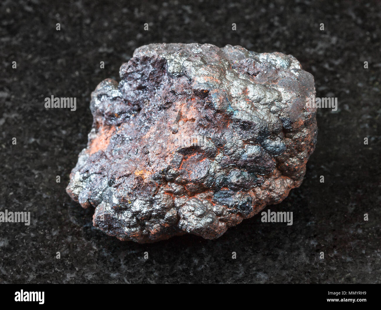 macro shooting of natural rock specimen - raw Goethite stone on black ...