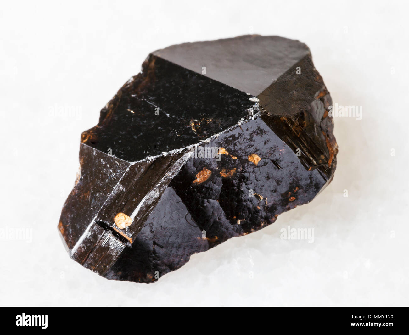 macro shooting of natural rock specimen - rough crystal of Cassiterite ...