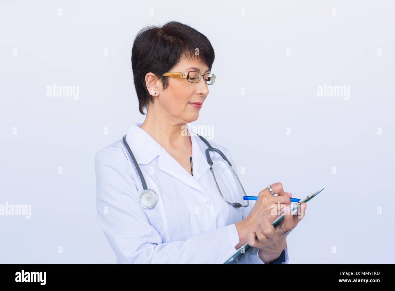 Medical doctor writing prescription over white background Stock Photo ...
