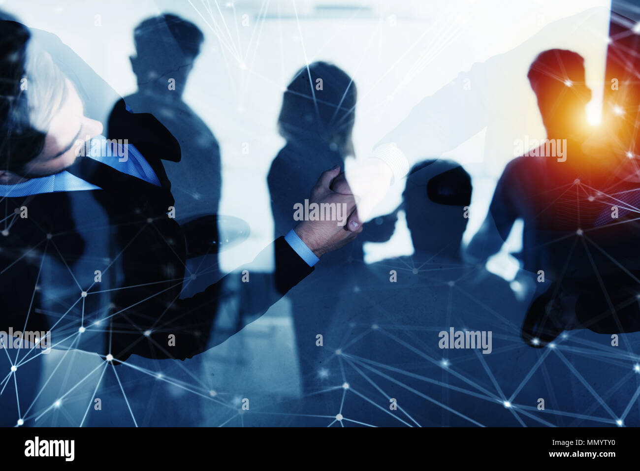 Handshaking business person in office with network effect. concept of ...