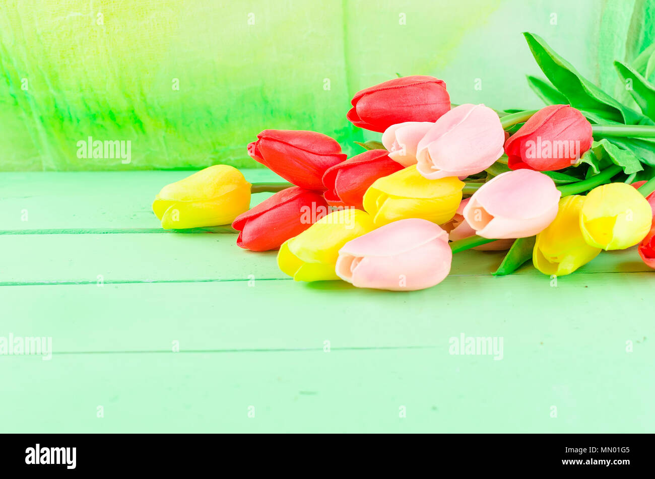 Top view of beautiful spring colorful tulips bouquet and gift with ...