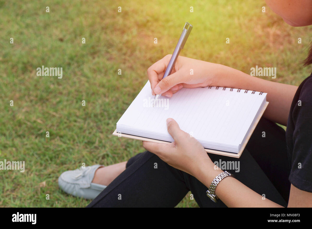hand of women writing on paper at filed Stock Photo - Alamy
