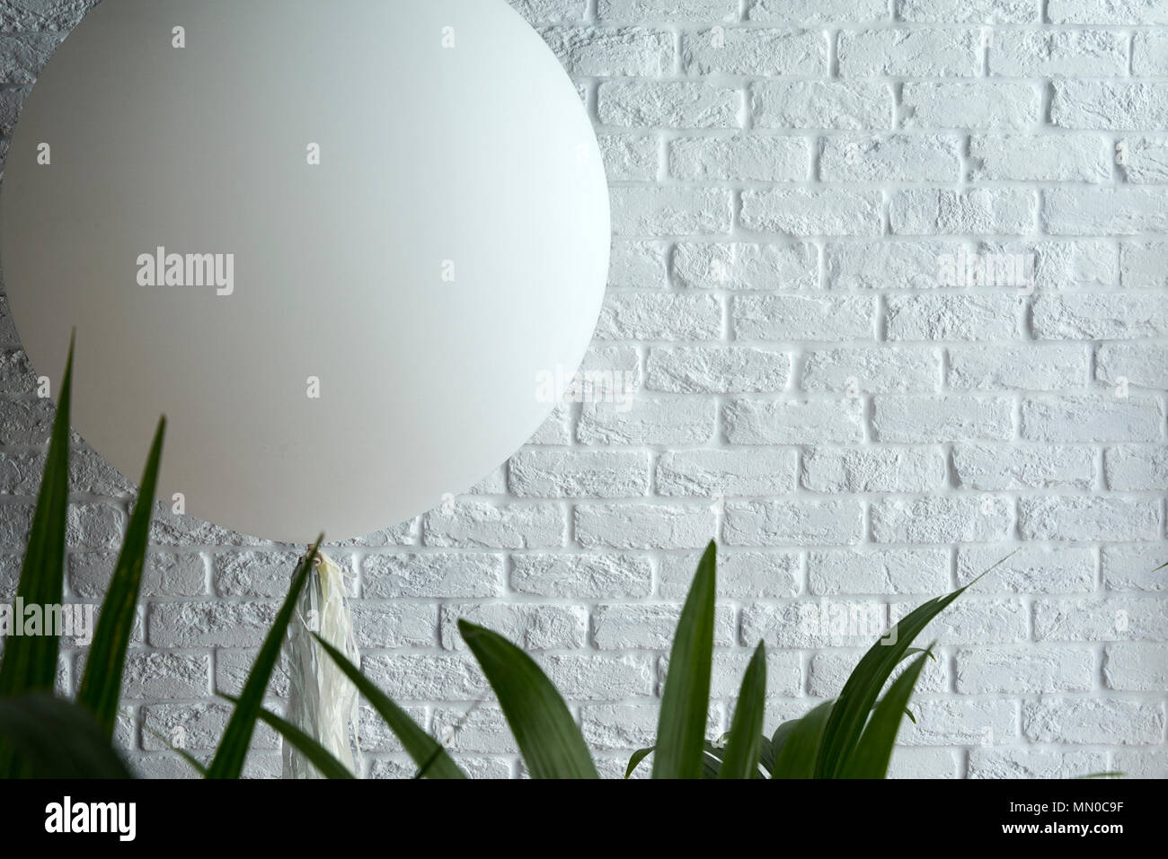 White inflatable balloon near the wall as the background Stock Photo ...