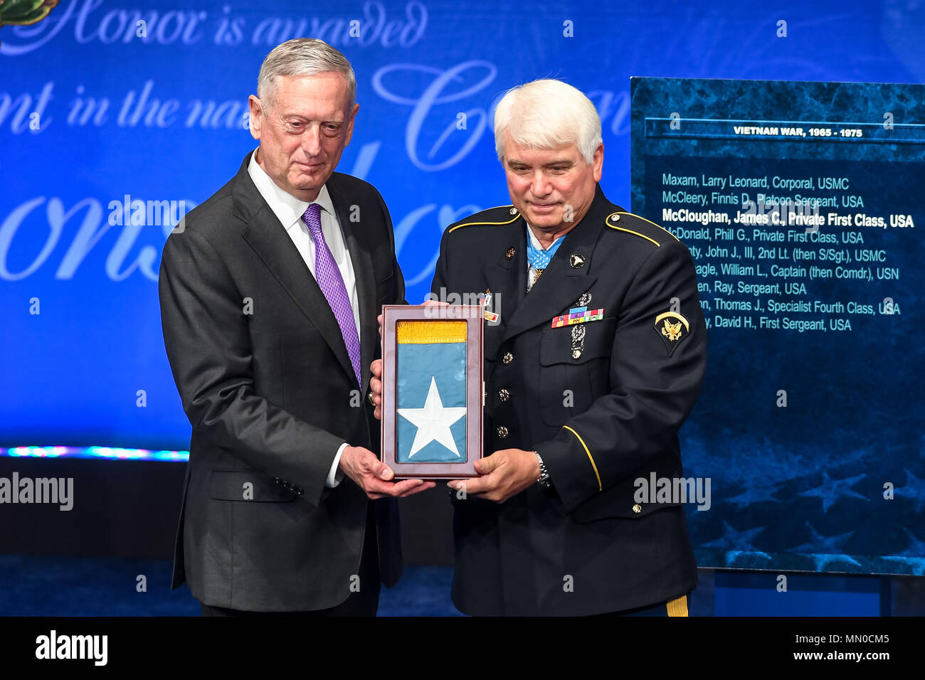 Secretary of Defense James Mattis presents the Medal of Honor flag to ...