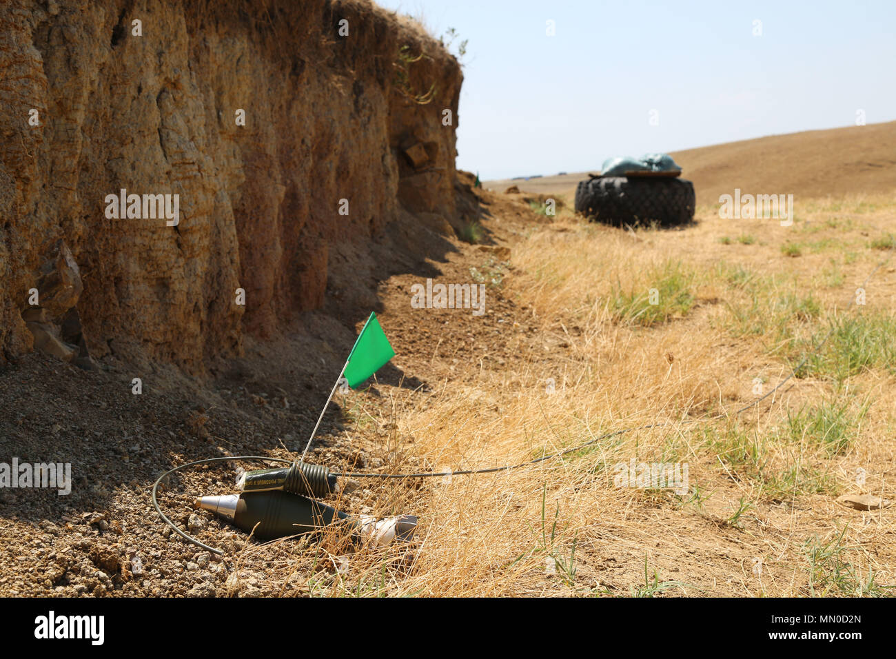 An 82mm high explosive mortar sits with a placed counter charge during ...