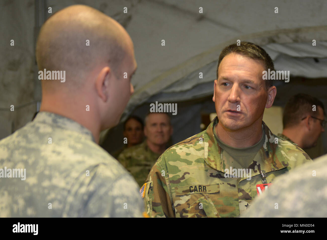 Indiana’s Adjutant General, Maj. Gen. Courtney P. Carr, right, listens ...