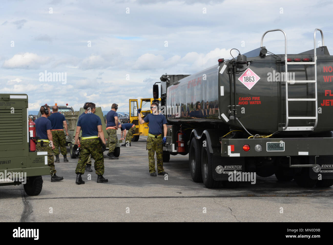 Royal Canadian Air Force (RCAF) airmen speak amongst themselves as a U ...