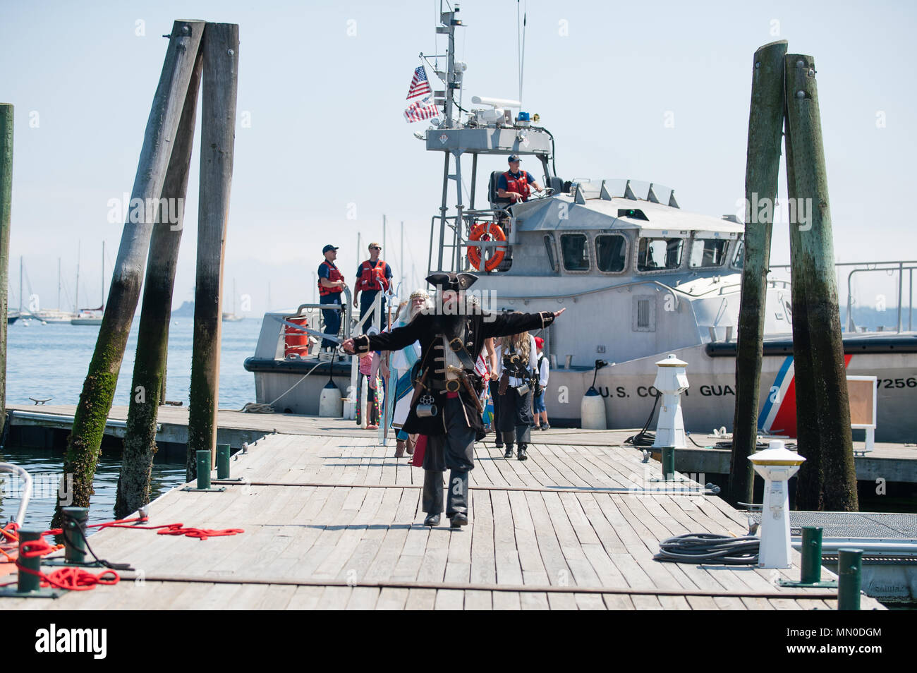 Blackbeard leads King Neptune and his court from Coast Guard Station ...