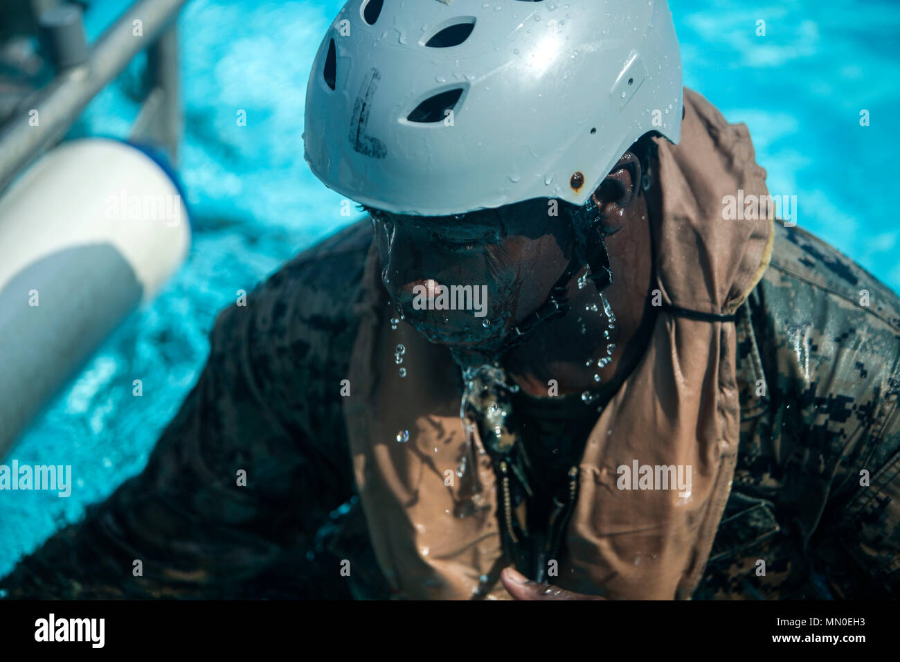 Lance Cpl. Tevin Poulson rises from the water during Underwater Egress ...