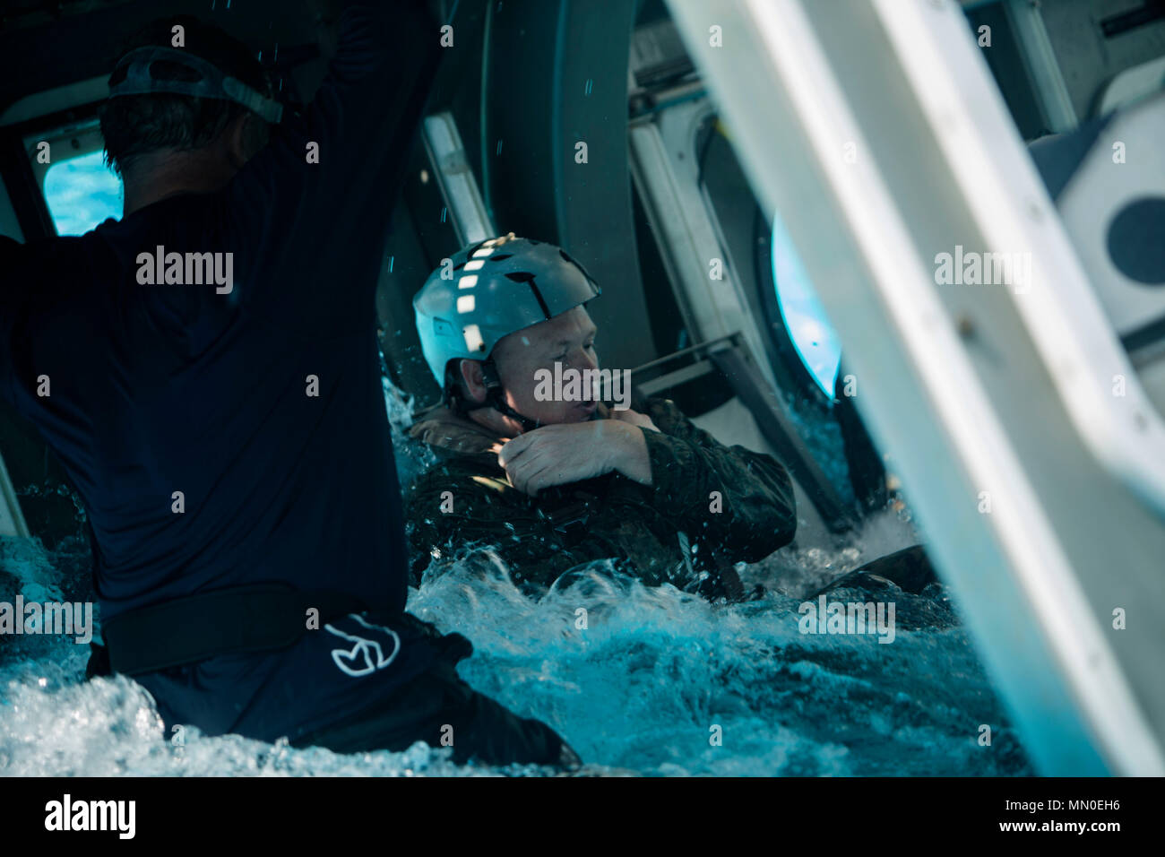 Staff Sgt. James Arnold descends underneath the water in the “Helo ...
