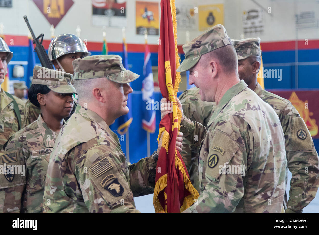 Col. Bradley Swift, incoming commander of the 595th Transportation Brigade, left, receives the ...